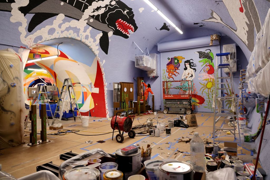 Taki and Molly Kitamura paint Realm Cellar's entrance to the Cave of ...